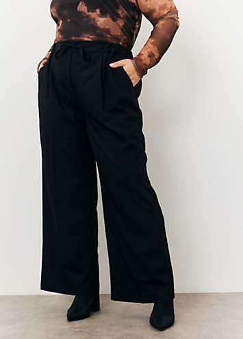 Jess Millichamp Curve Black Wide Leg Trousers by In The Style | Look Again